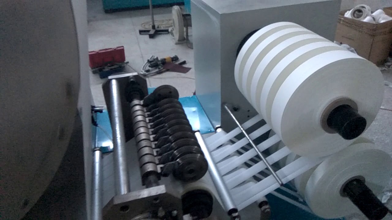 Automatic gluing cigarette paper slitting machine - YouTube