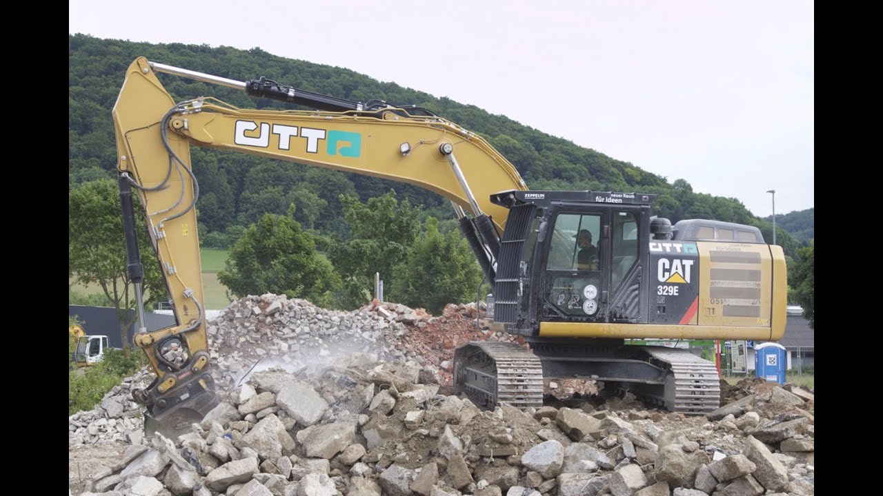 Cat 329 E beschickt Kleemann Brecher - YouTube