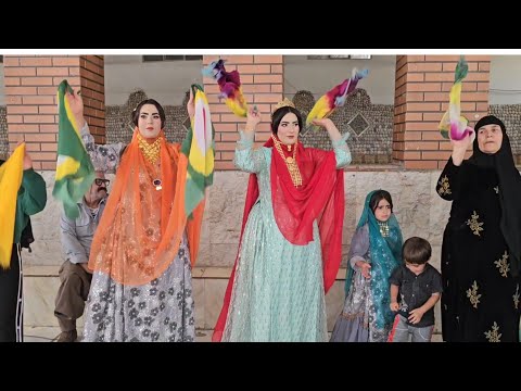 Parisa and Ziba at a wedding celebration—a joyful day of traditional folk dancing.