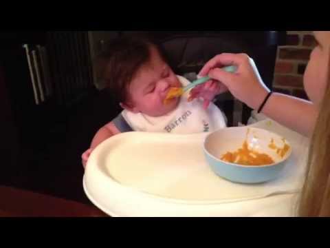 Babys first time eating solid foods - YouTube