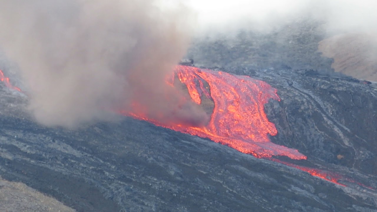 Lava sudden spill over Fagradalsfjall volcano Iceland - YouTube
