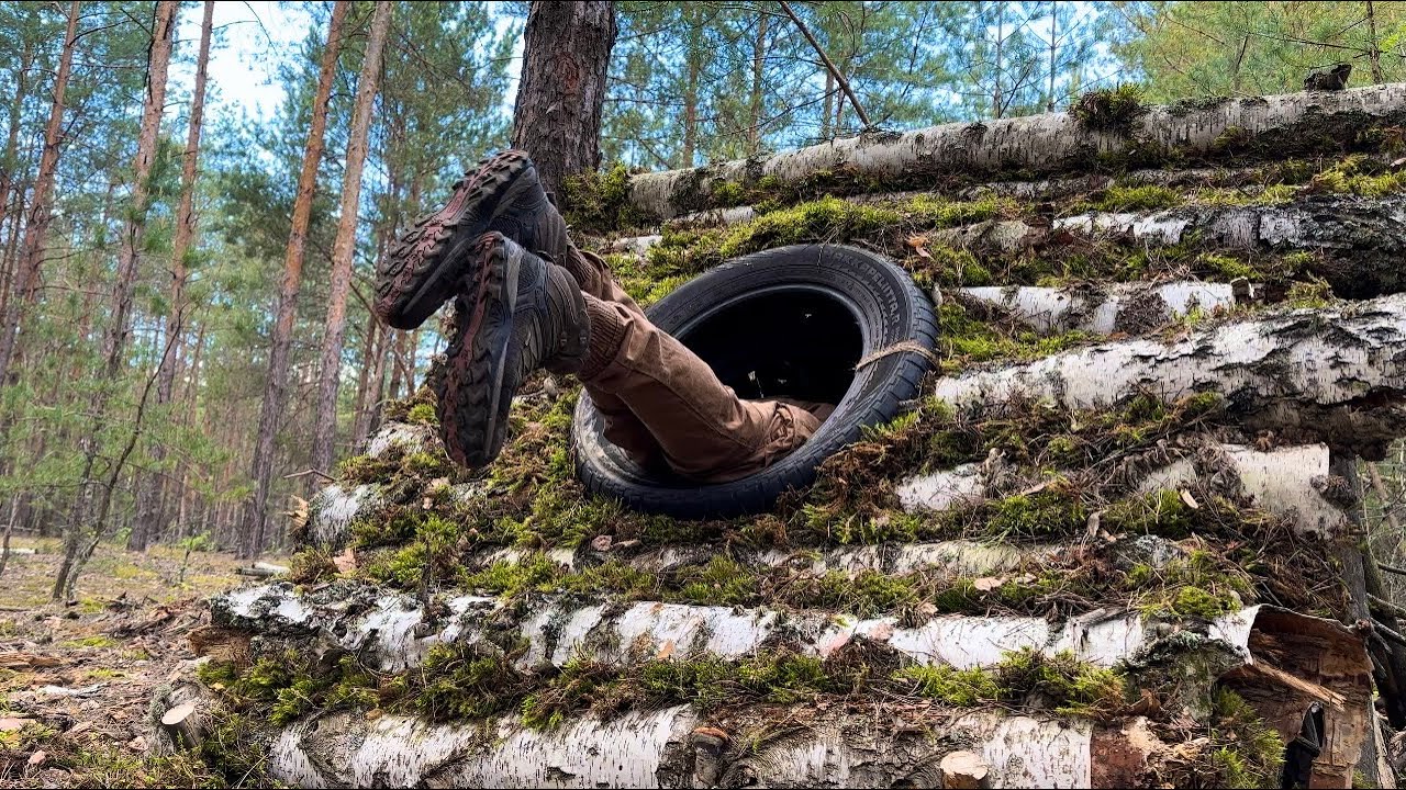 Building a simple hut from a wheel and logs | Hiding from the wind in ...