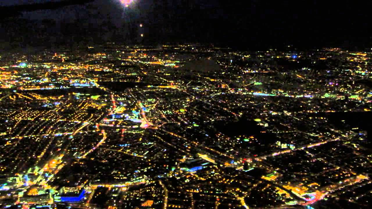 STUNNING Nightime aerial view of London city centre as plane approaches ...