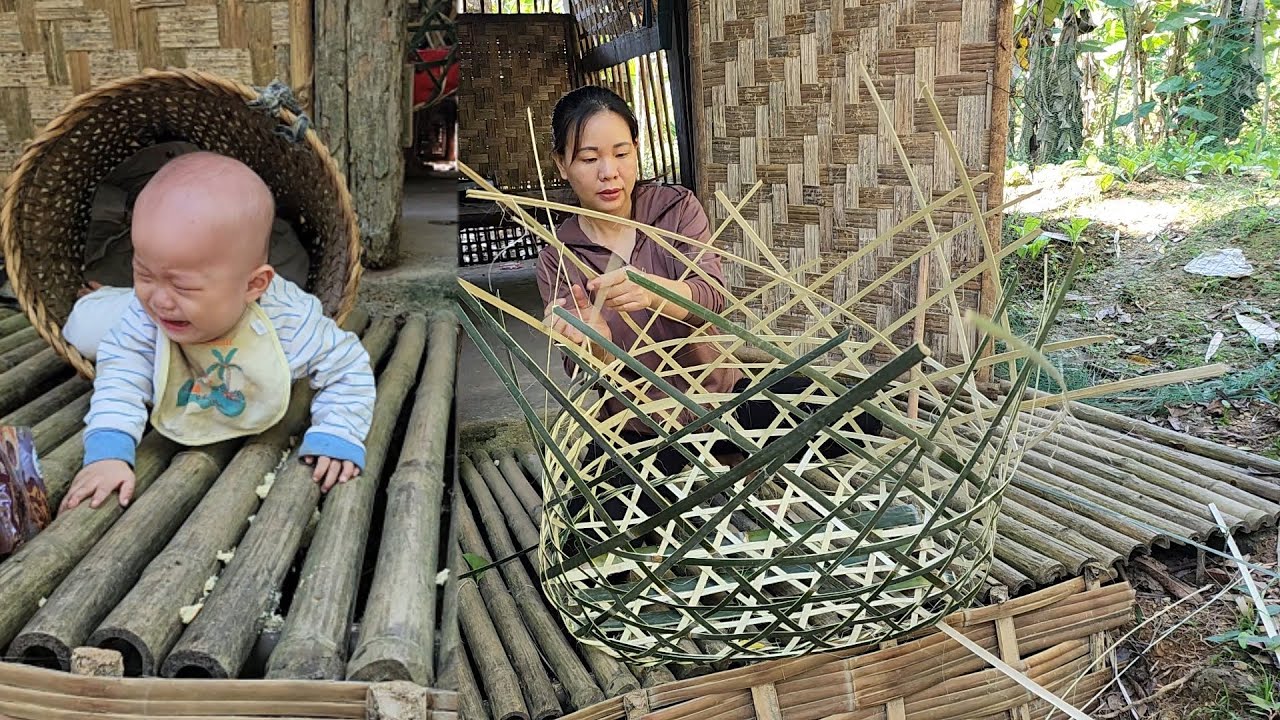 Single mom. Completing a bamboo cradle for your son - simple happiness ...