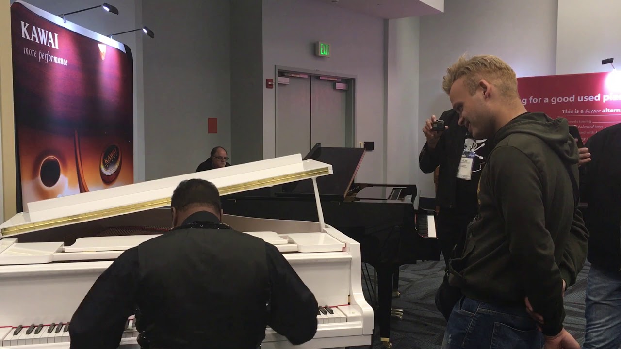 Jesus Molina watching Kris Nicholson play ragtime piano at NAMM 2020 ...