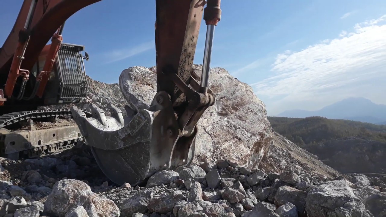 Rolling down Huge rocks from mountain with Hitache 850 - YouTube