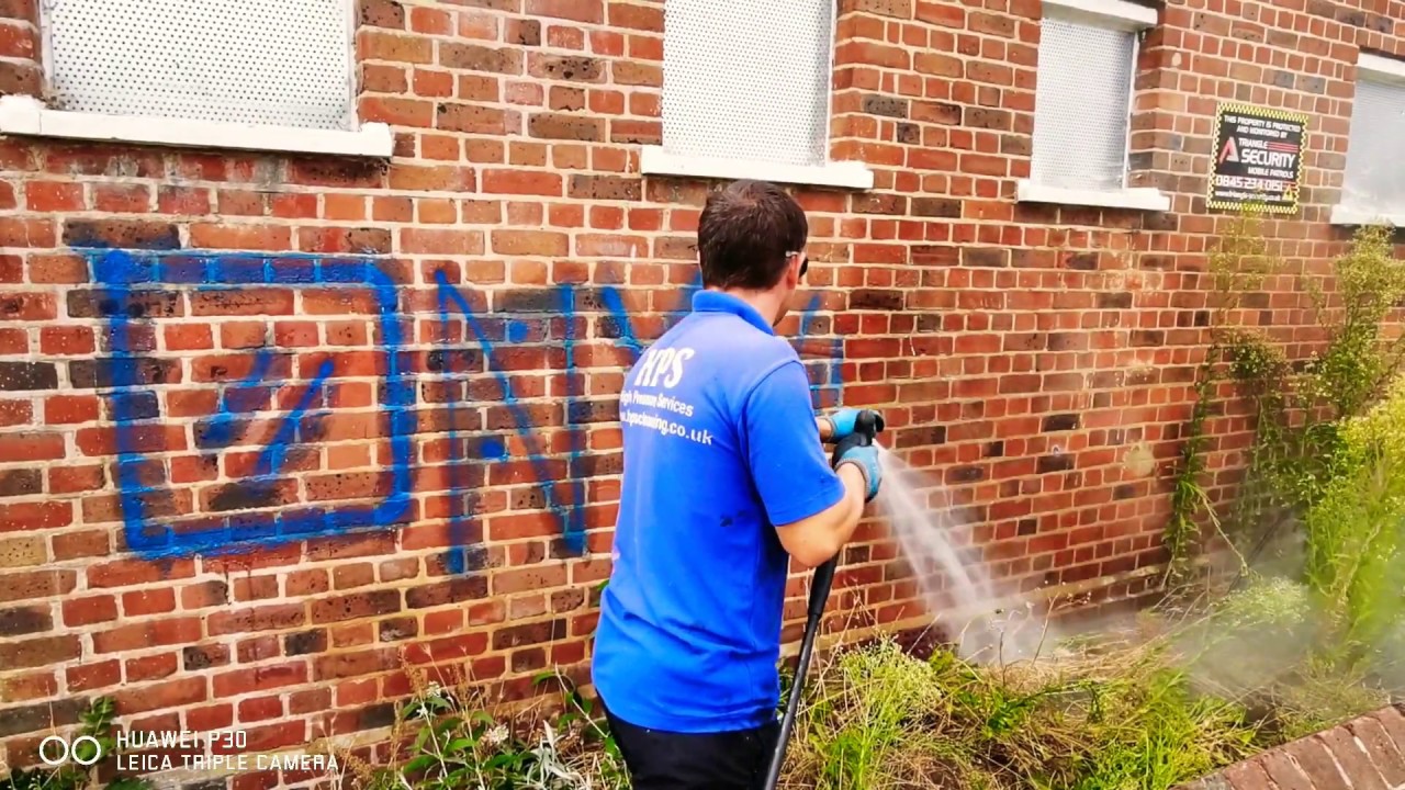 Graffiti removal from brick wall. - YouTube