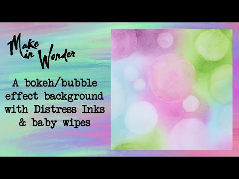 A bokeh/bubble effect background with Distress Inks & baby wipes