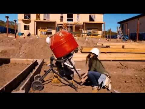 Girl sitting under machine and guy wearing no mask