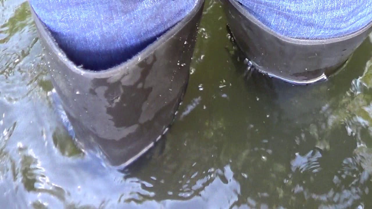 Flooding waders in a lake. - YouTube