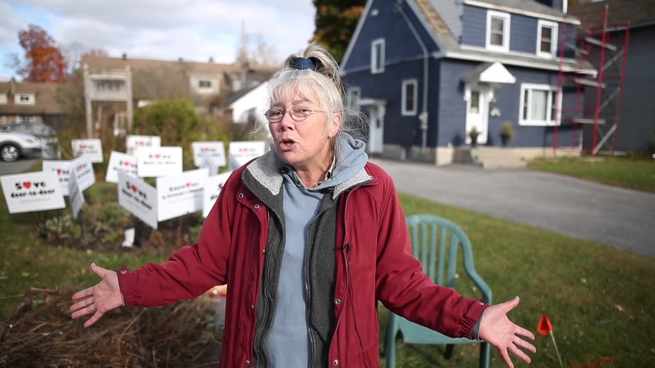 Woman protests Canada Post superbox - YouTube