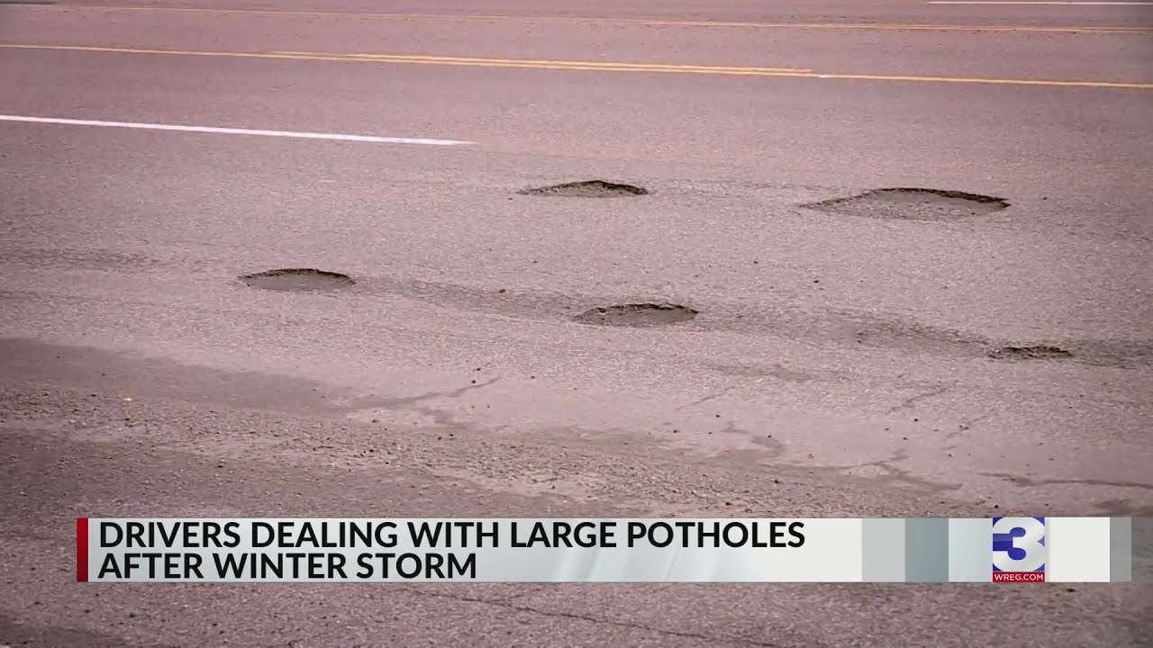 Drivers dealing with large potholes after winter storm - YouTube