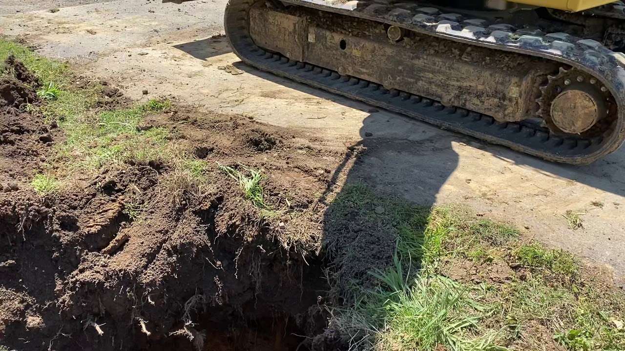 Boring Under a Driveway using an Auger - YouTube