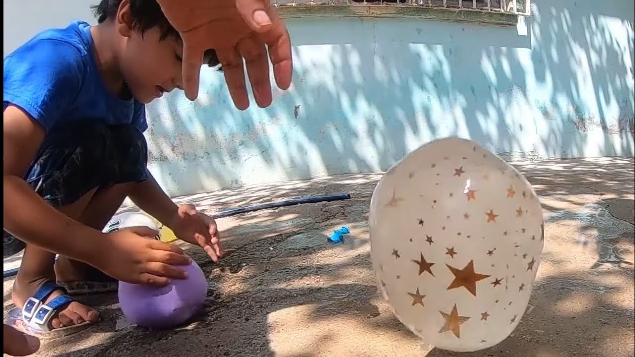Bouncing Popping balloons in slow motion - YouTube