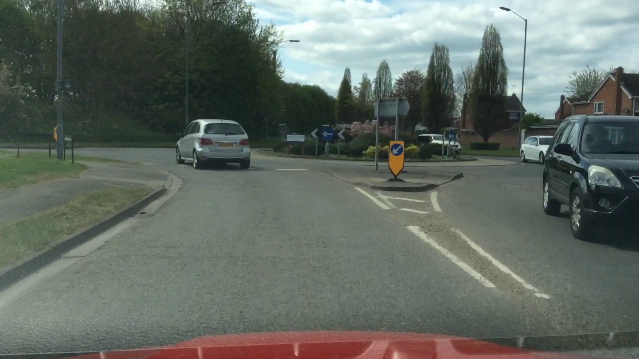 Pulling up on right side of road, reverse 2 car lengths then drive off ...