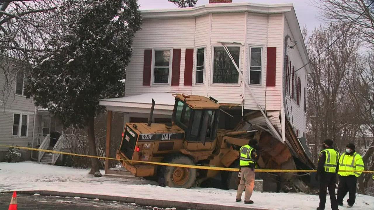 Front-end loader crashes into home in Biddeford - YouTube