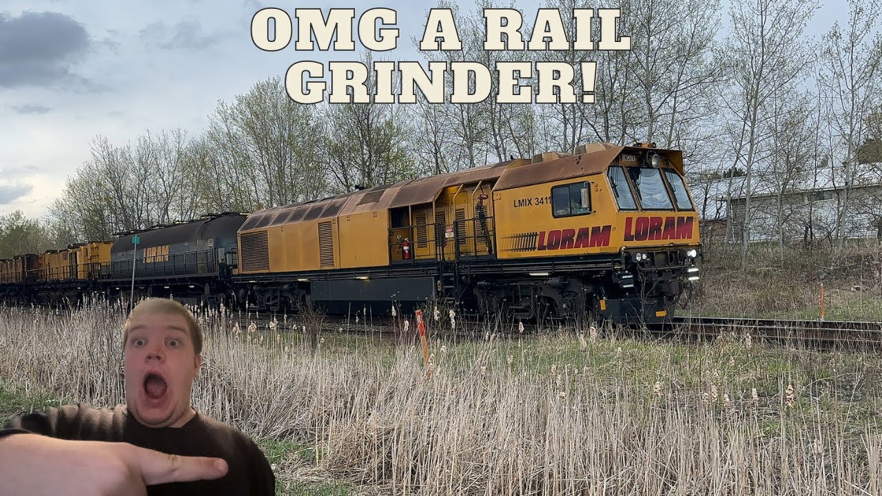 (SD60 5446 and a LOREM Rail Grinder) CN M313 and W912 at Mount Albert ...