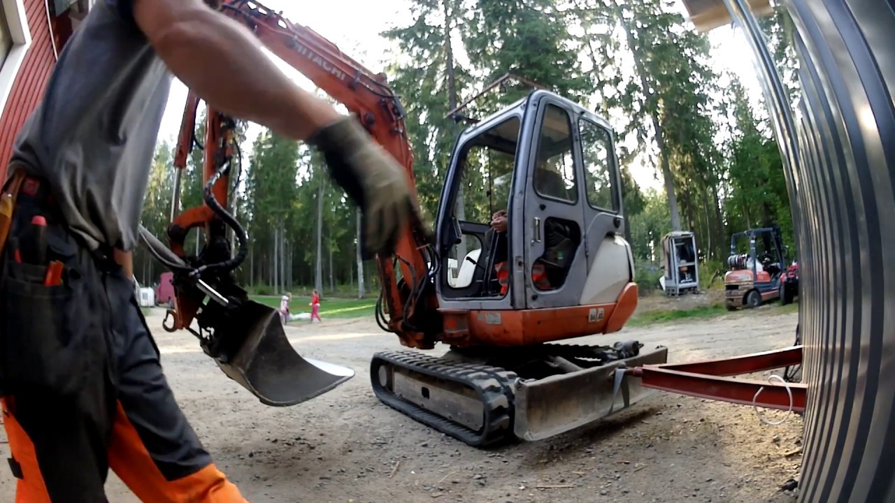 Relocating tiny house with mini excavator - YouTube