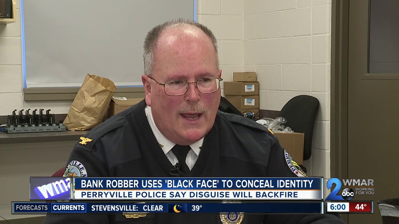 Bank robber uses 'black face' to conceal identity - YouTube
