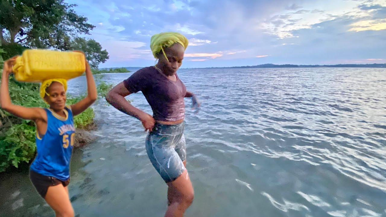 African village lifestyle//@Lovis256 taking outdoor bath in the lake ...