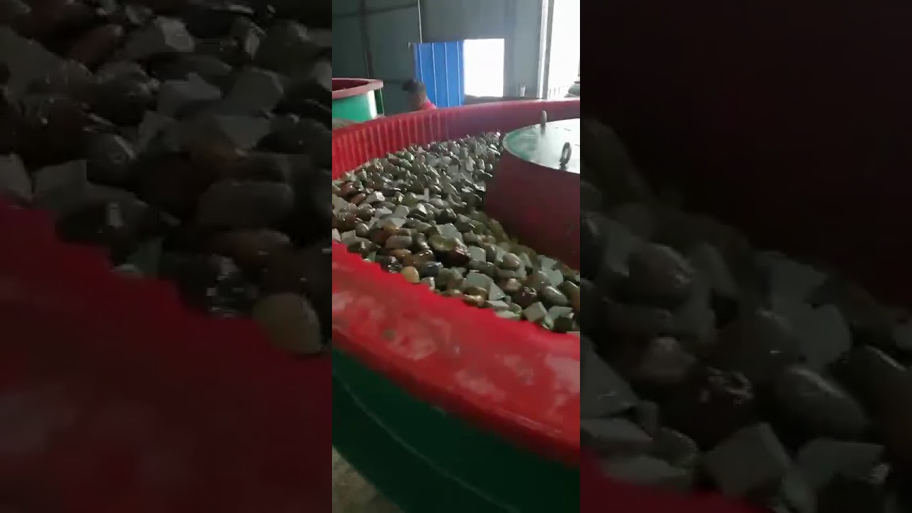 vibratory finishing machine pebble stone polishing - YouTube