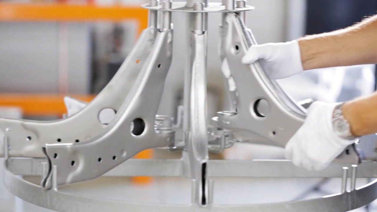 Coating in a rack dip spinning system - YouTube