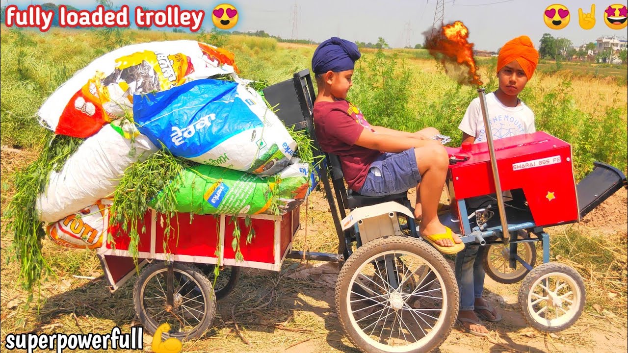 Homemade mini tractor pulling heavy loaded trolley with grass |DIY ...