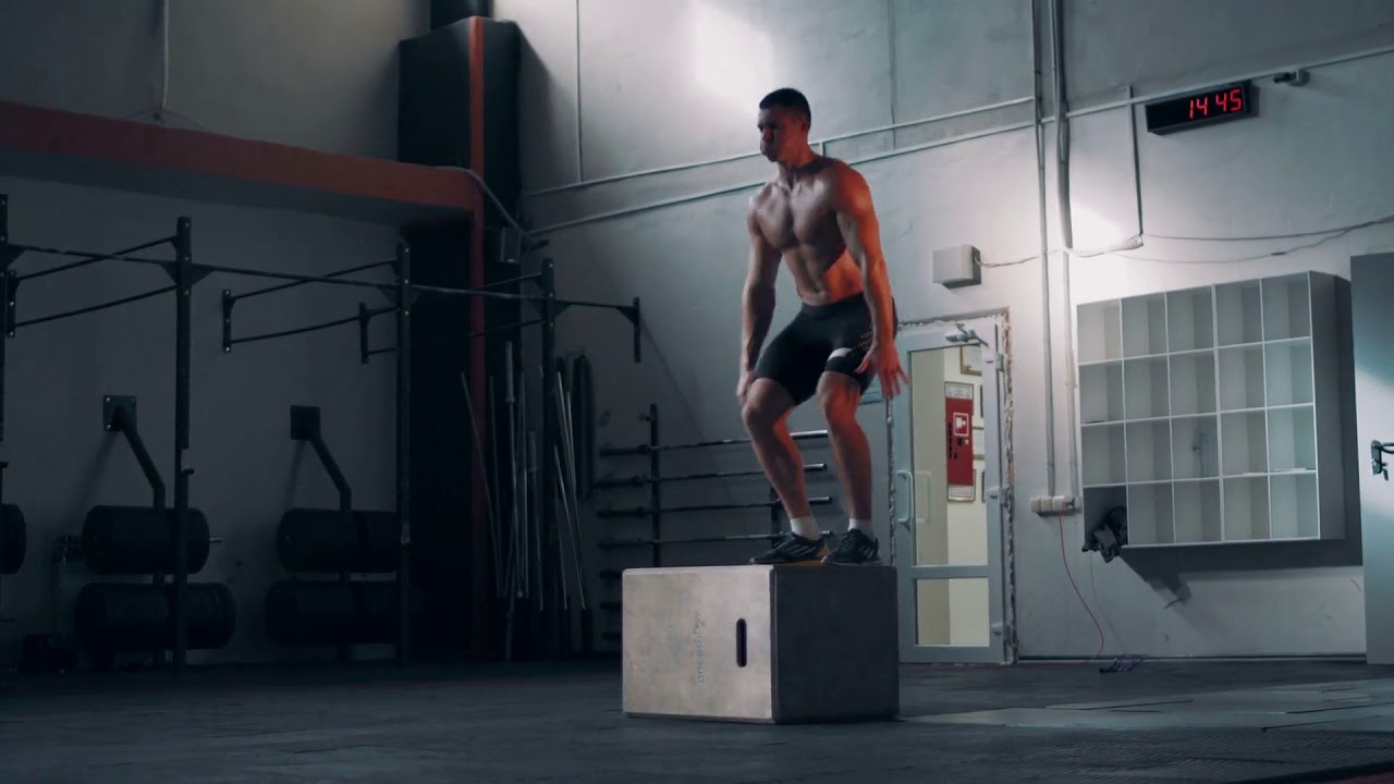 muscular man doing box squat exercise in crossfit gym - YouTube