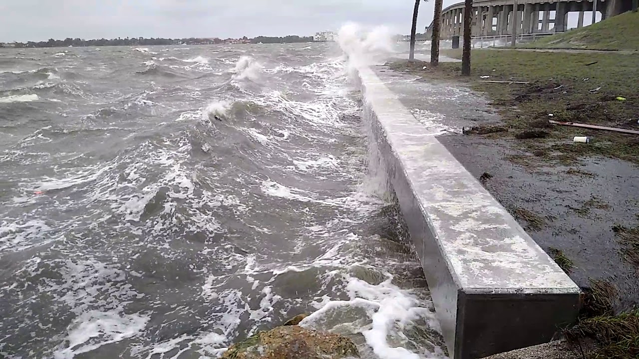 Incredible beauty in waves crashing against seawall - YouTube