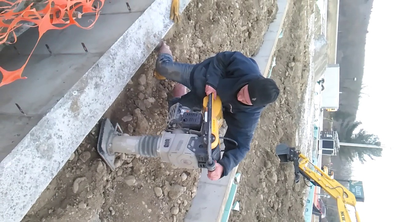 Tamping backfill. - YouTube