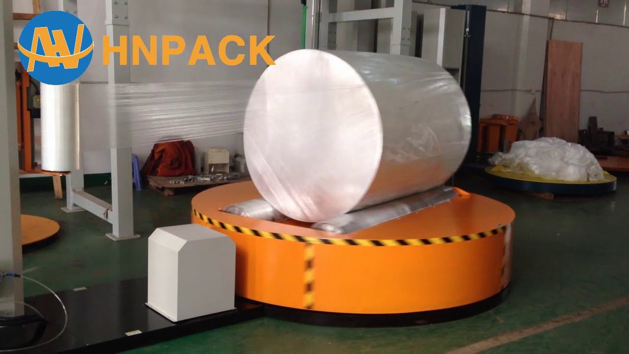 Roll wrapper for paper reel wrapping packing video in factory - YouTube