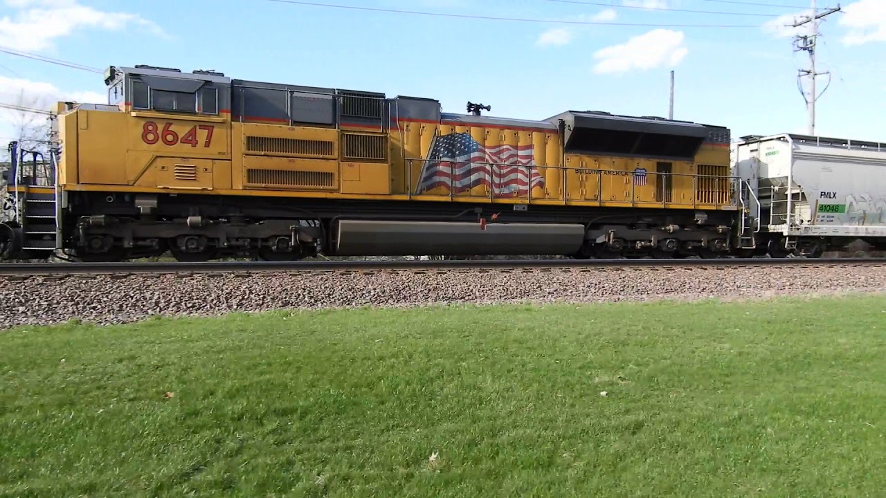 UP 8373 and NS 9493 lead a manifest with UP 8647 as the mid DPU east in Geneva IL - YouTube