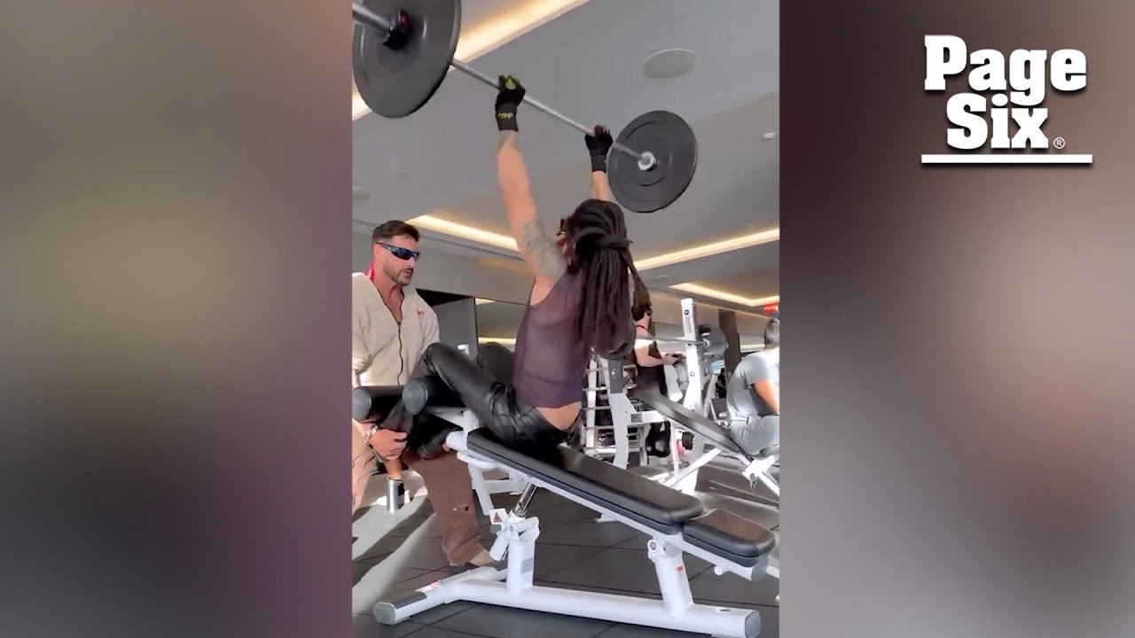 Lenny Kravitz lifts weights in leather pants and sheer tank top ...