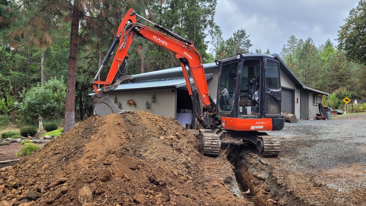 Tricky trenching with the Kubota KX 040 4 - YouTube