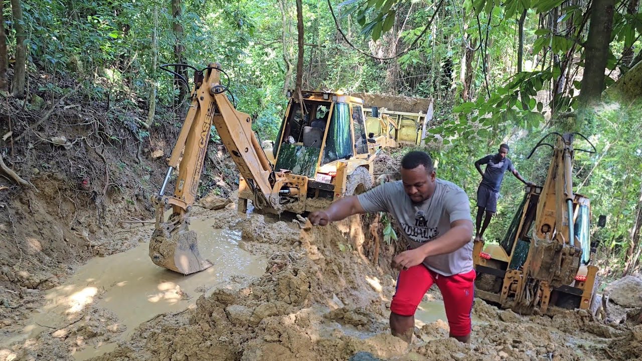 Stuck? | Nature vs man with machine | skilled Backhoe operator cleaning ...