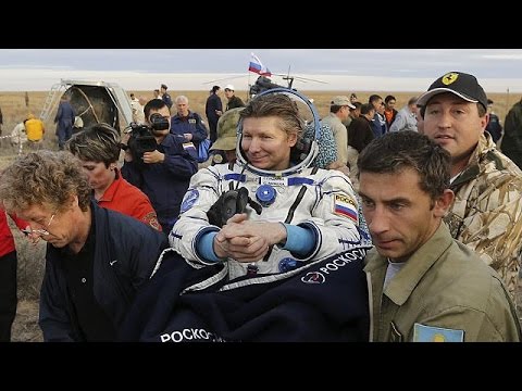 Record-breaking Russian cosmonaut returns to Earth - YouTube