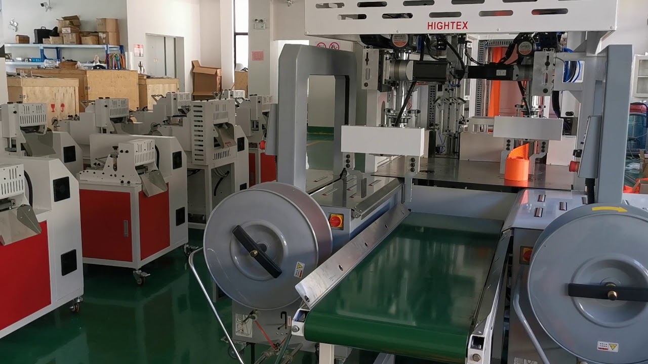 Automated hot cutting, winding and strapping machine for 100mm webbing ...