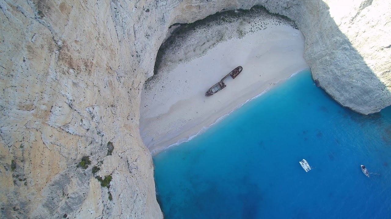 BASE JUMPING AT SHIPWRECK BEACH ZAKYNTHOS (drone footage) - YouTube