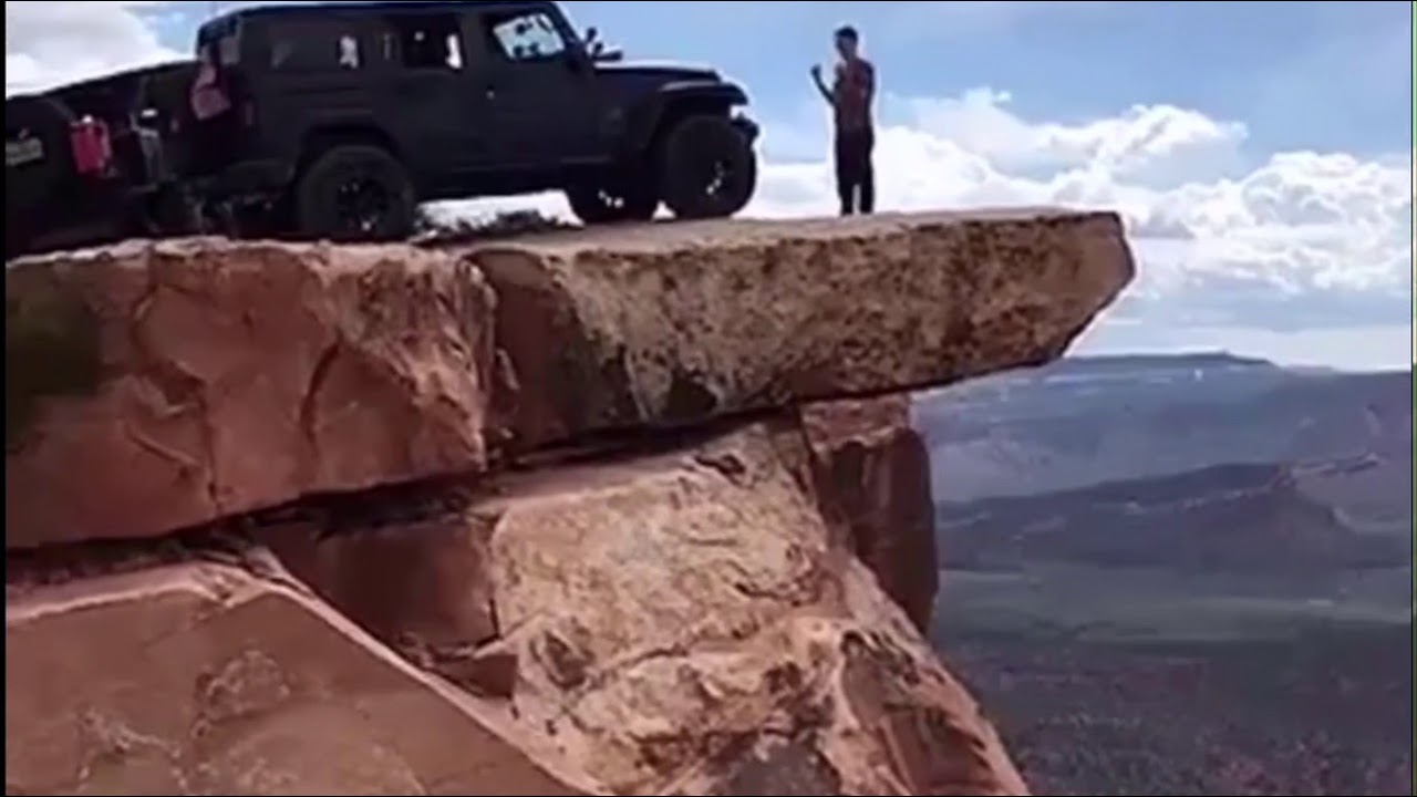 Driving onto the ledge on Top of the World in Moab - YouTube