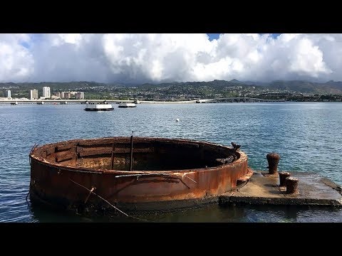 USS Arizona Gun turret #3 and stern rise above waters of Battleship row ...