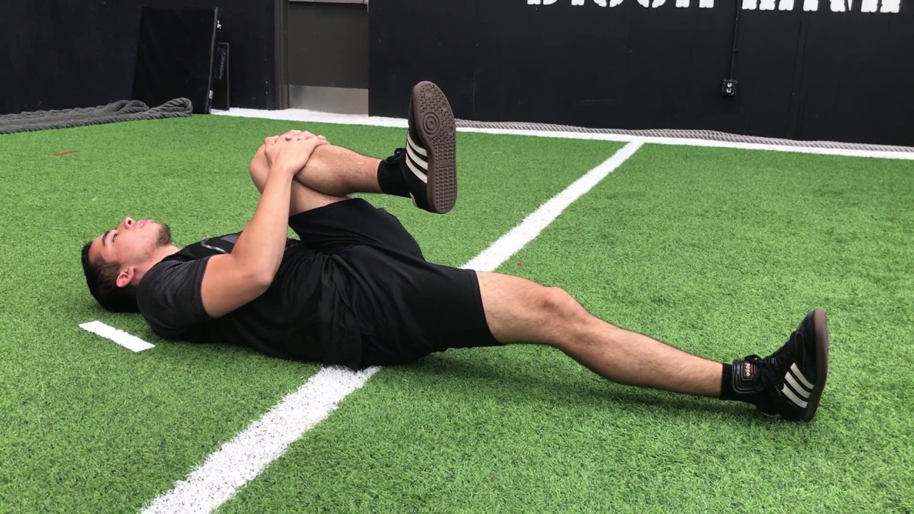 Lying Frontal Knee Hug Stretch - YouTube