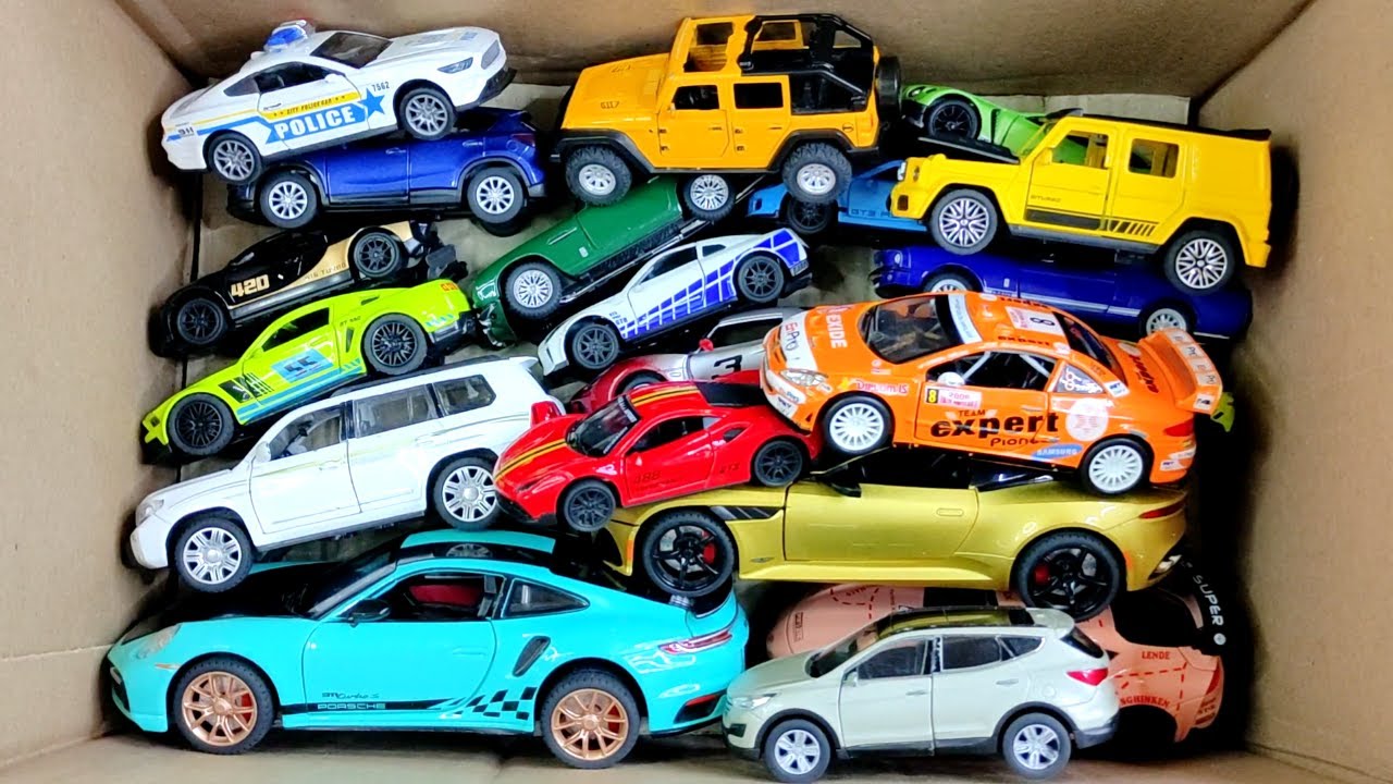 Box full of various miniature cars Peugeot, Hyundai, Mazda, Honda ...