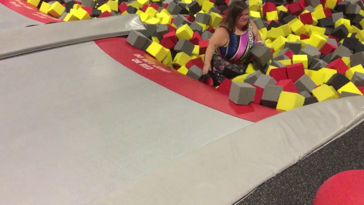 Kelly waving in foam pit at Area 51 trampoline Baton Rouge - YouTube