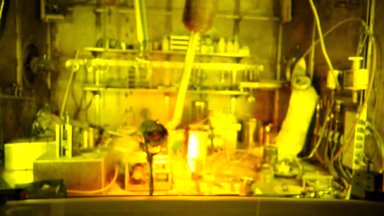 Working the diamond saw in the hot cell - YouTube