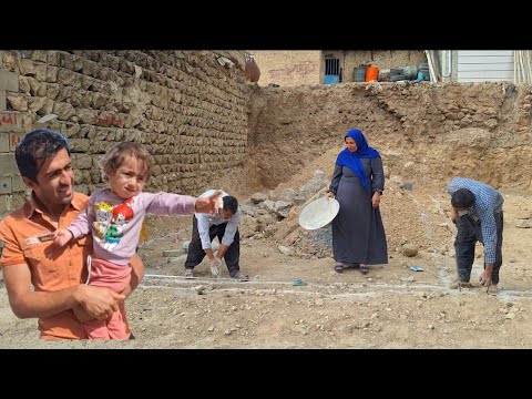 In this video, the Dal family prepares their building materials with a heavy machine.