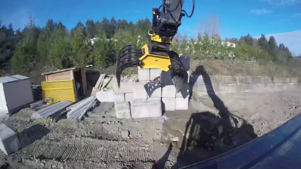 Playing with concrete LEGO using the Engcon Grapple - YouTube