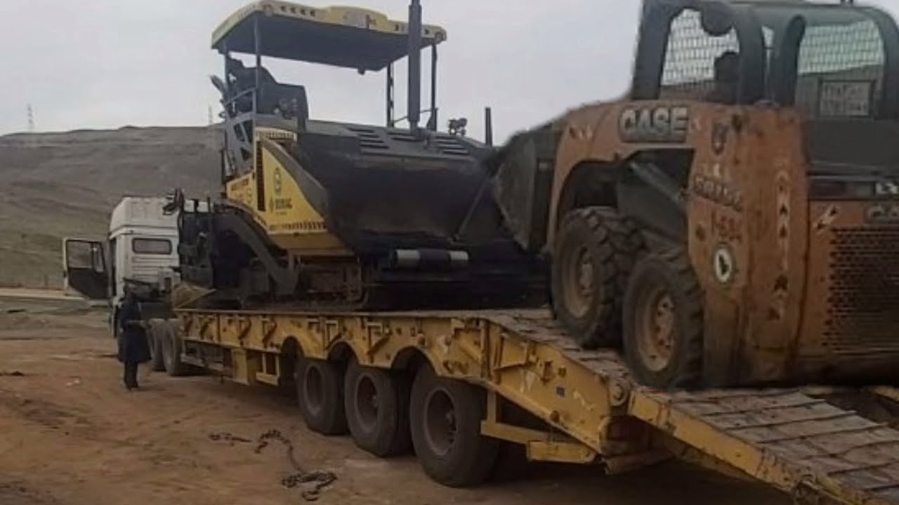 HOW TO UNLOADING THE ASPHALT PAVER MACHINE AND BOBCAT. - YouTube