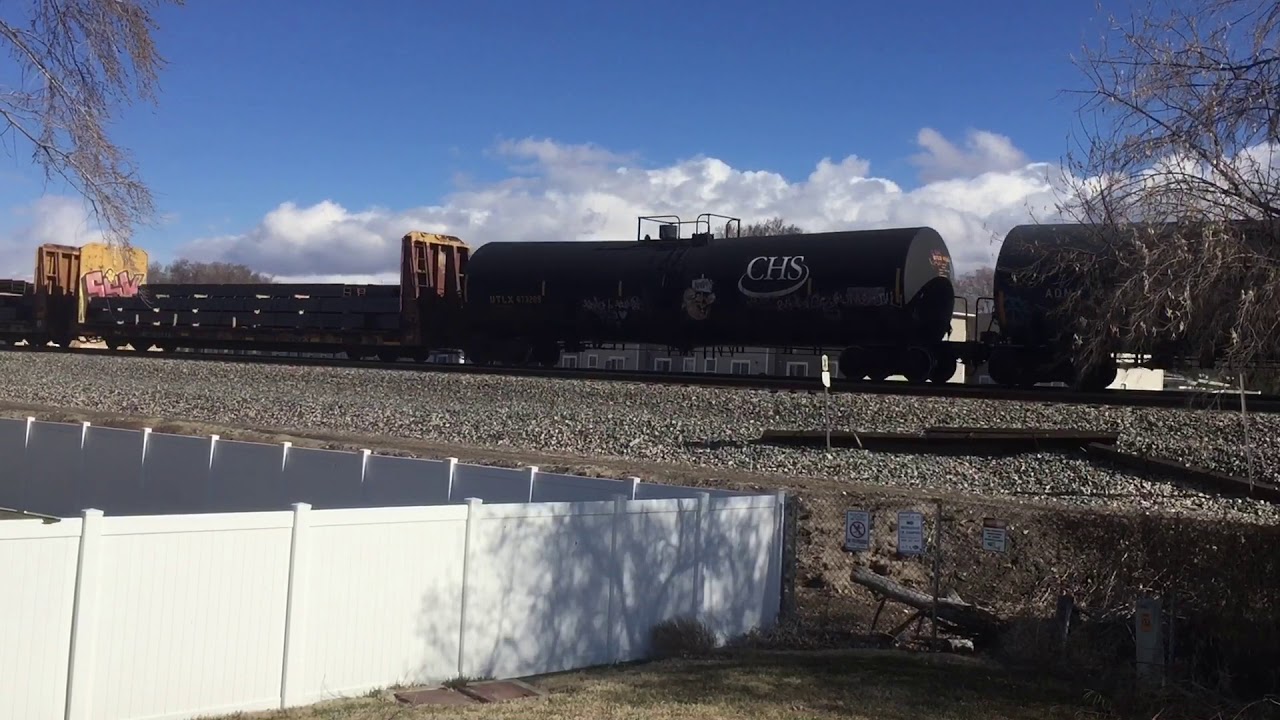 MHKRO led by X CNW AC44 8819/ U P 6721 in Clinton Utah with SD60M 2381/ ...