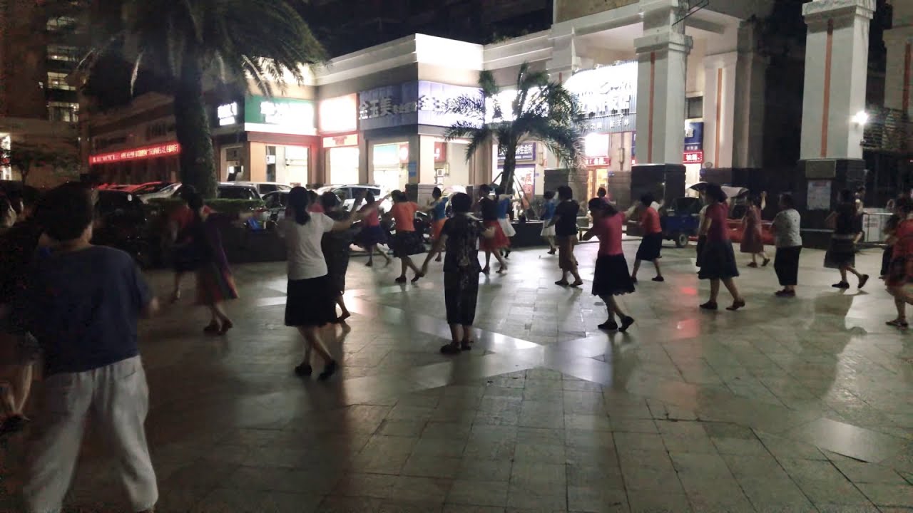 Chinese dama dancing at evening with happy music, no covid-19 pandemic ...