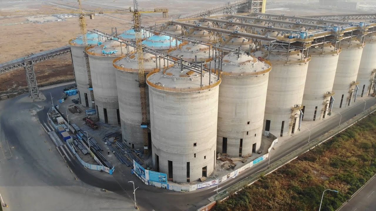 Silos capped at grain, oil logistics center in north China - YouTube
